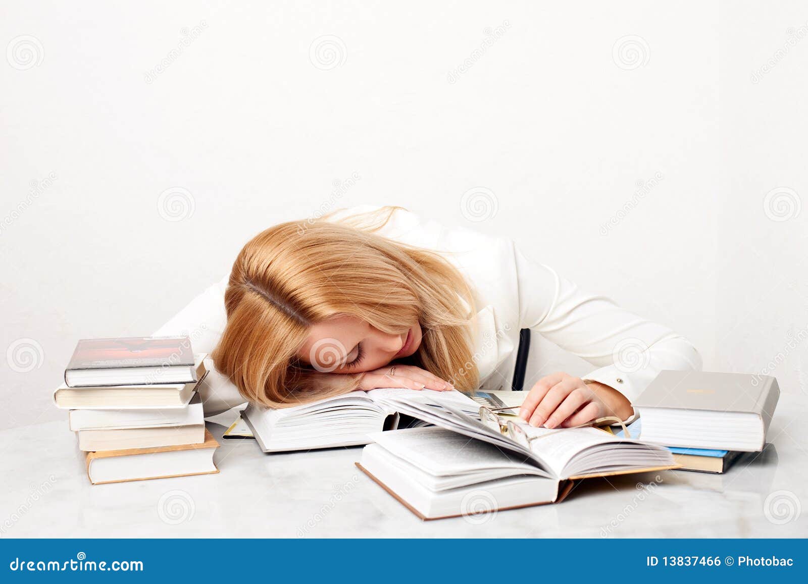 Young Woman Falling Asleep while Studying Stock Photo - Image of ...