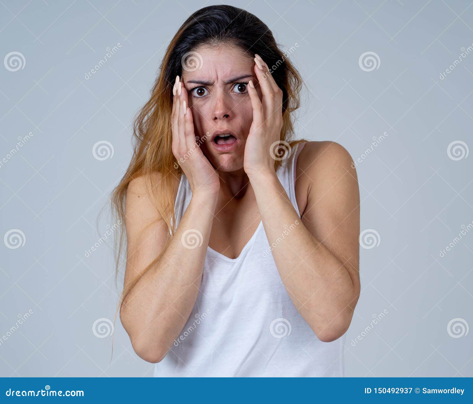 Portrait Of A Young Attractive Woman Looking Scared And Shocked Human