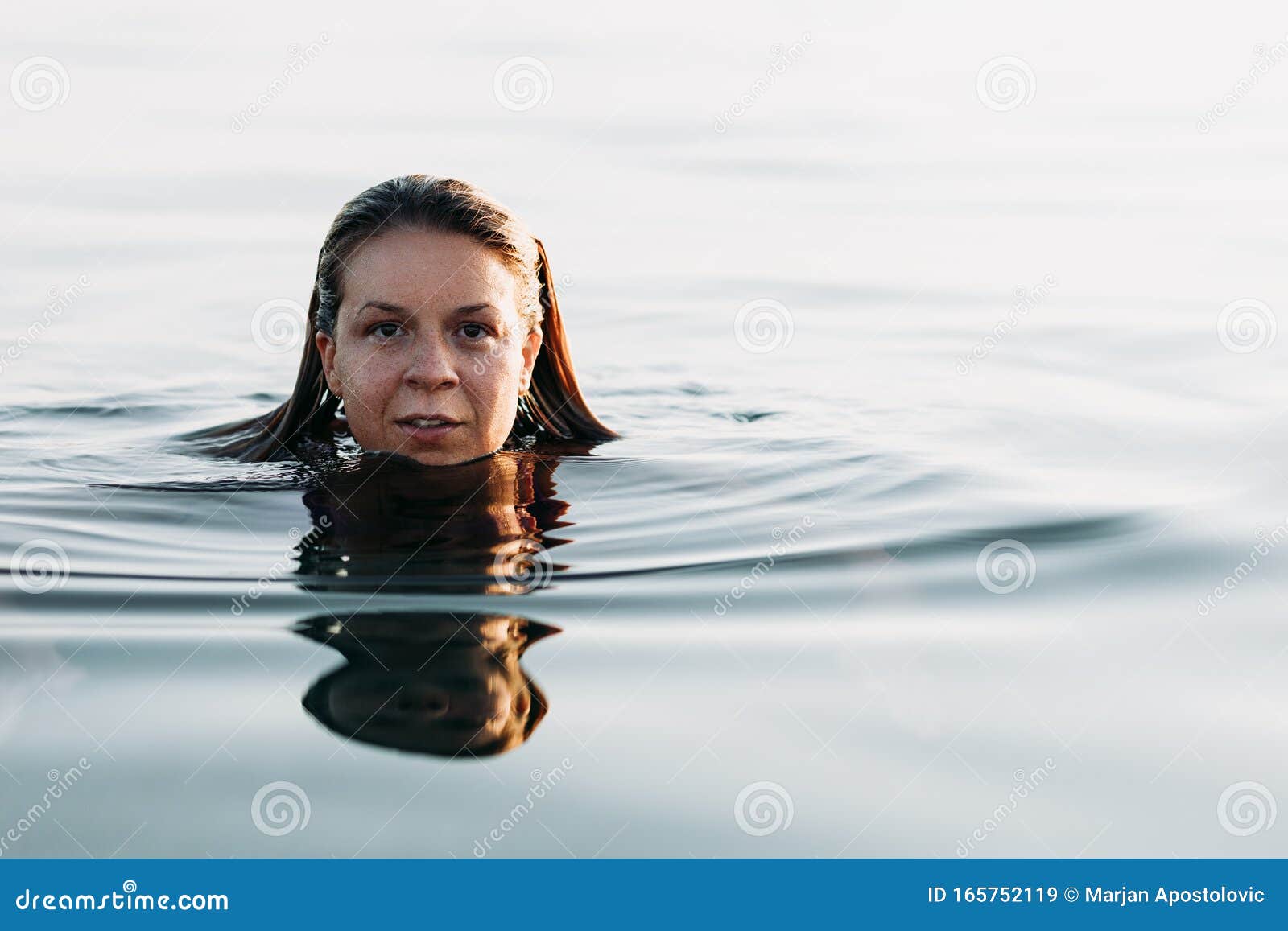 Young Woman Floating on the Water Surface in the Sea Stock Image ...
