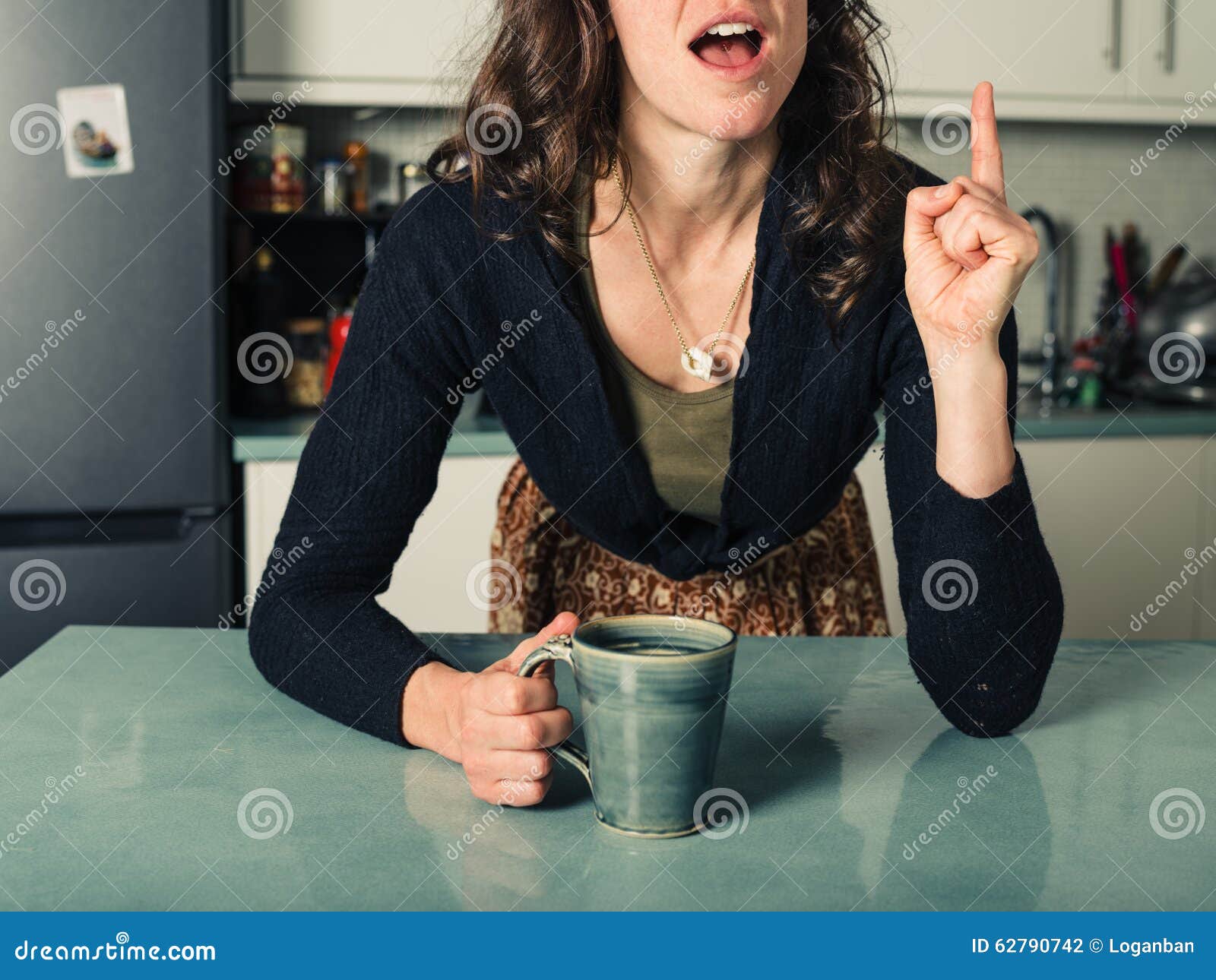 Young Woman Getting Idea in Kitchen Stock Photo - Image of dreaming ...