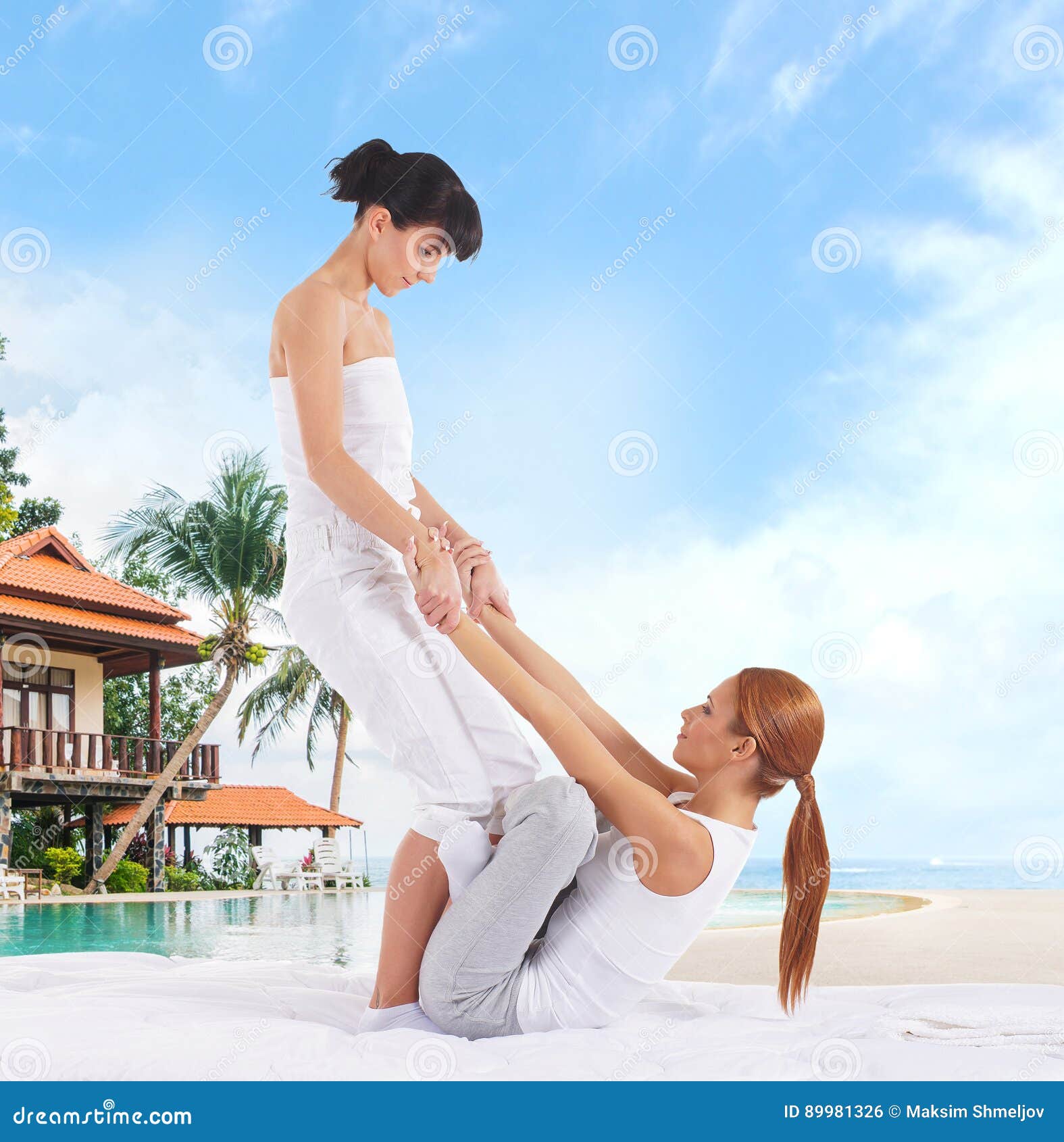 Young Woman Getting Traditional Thai Stretching Massage By Therapist