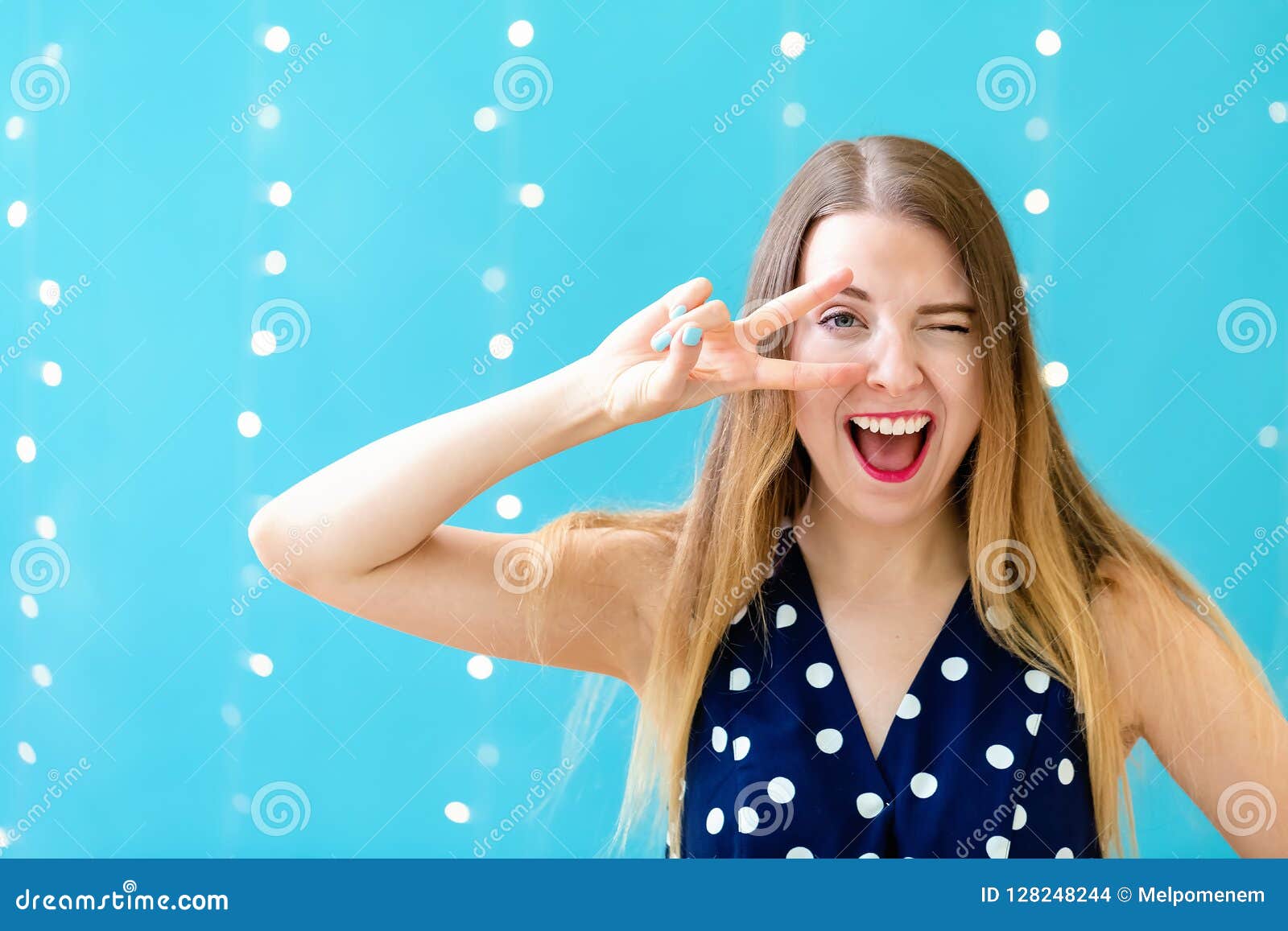Young Woman Giving the Peace Sign Stock Photo - Image of happy, light ... Young Woman Giving the Peace Sign Stock Photo - Image of happy, light ...