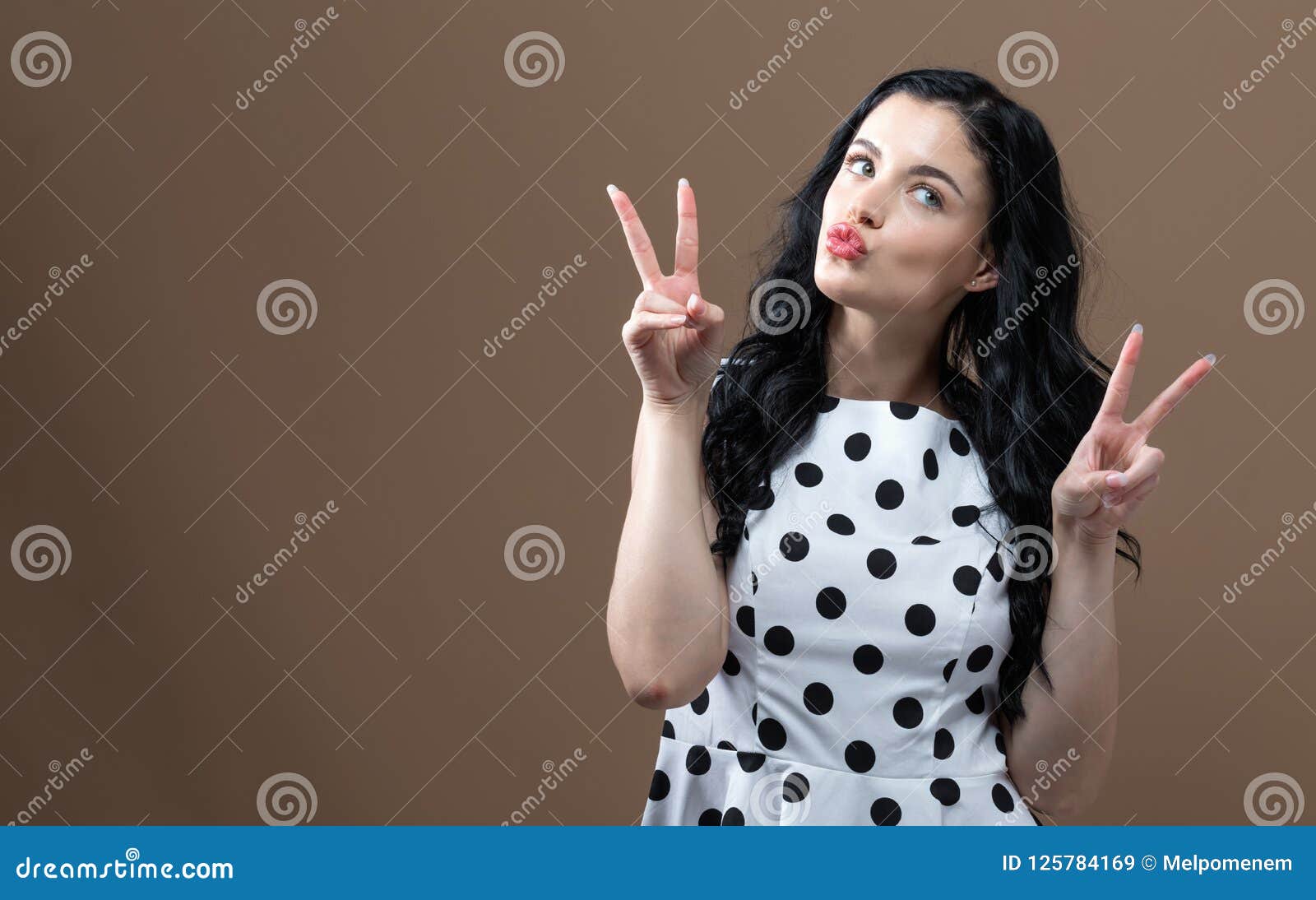 Young Woman Giving the Peace Sign Stock Image - Image of happy, solid ... Young Woman Giving the Peace Sign Stock Image - Image of happy, solid ...