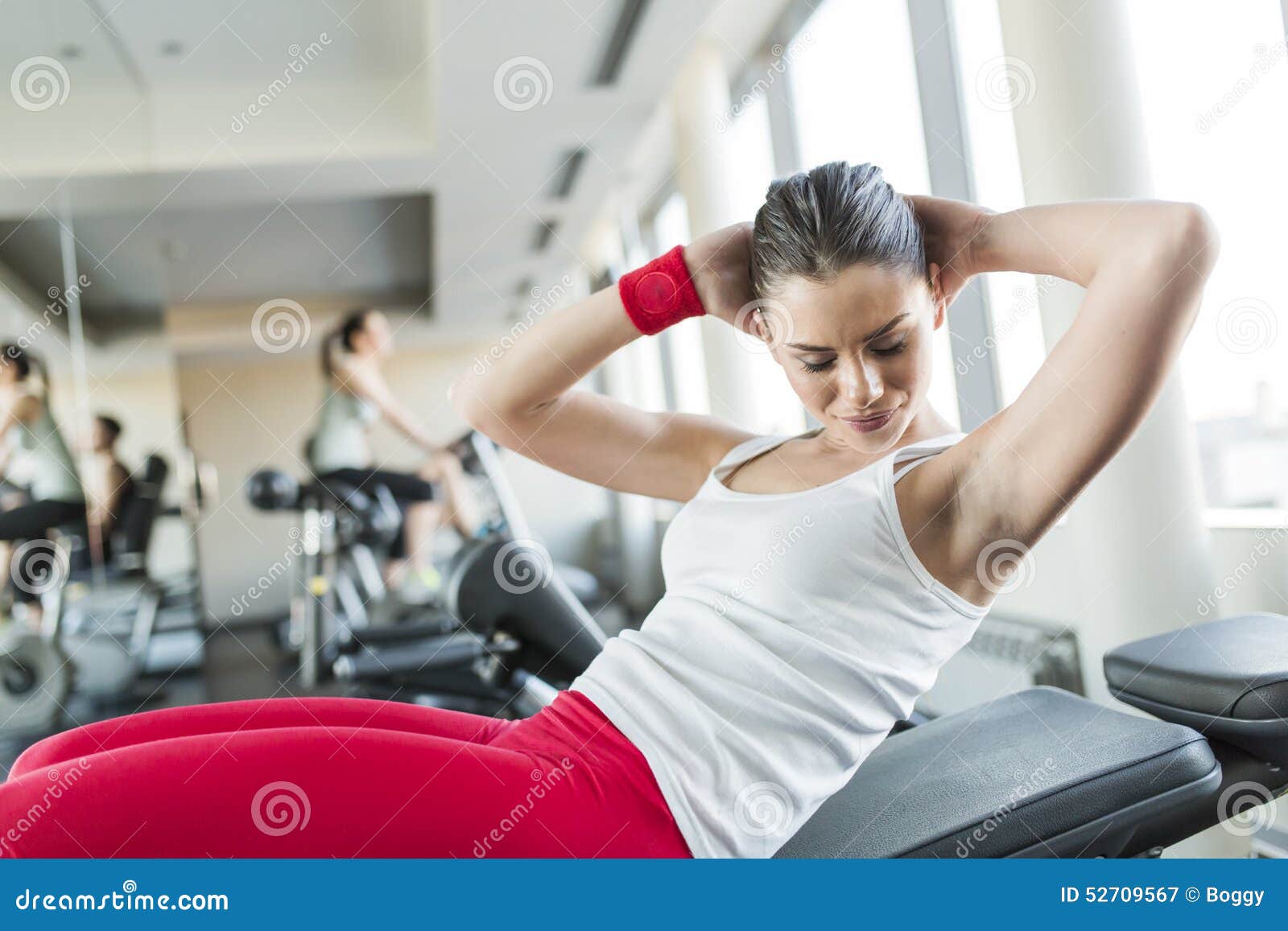 Young woman in the gym stock image. Image of fitness - 52709567