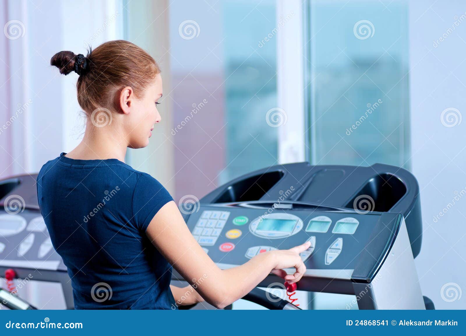 Young Woman at the Gym Run on on a Machine Stock Image - Image of blue ...