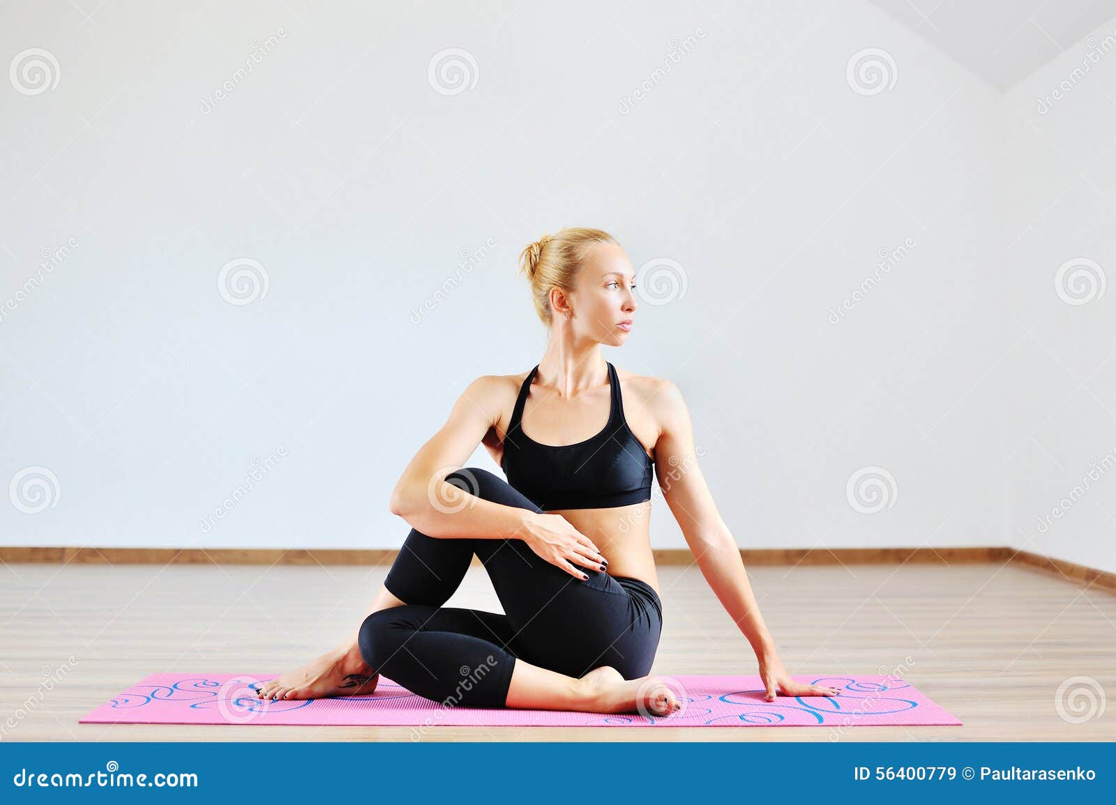 Young Woman In Half Spinal Twist Pose On Mat Royalty-Free Stock ...
