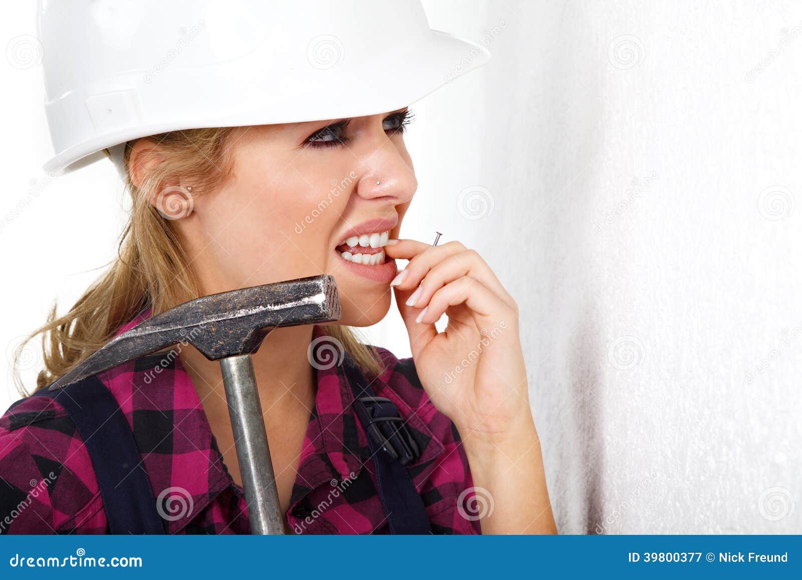 Young woman with a hammer stock image. Image of lady - 39800377