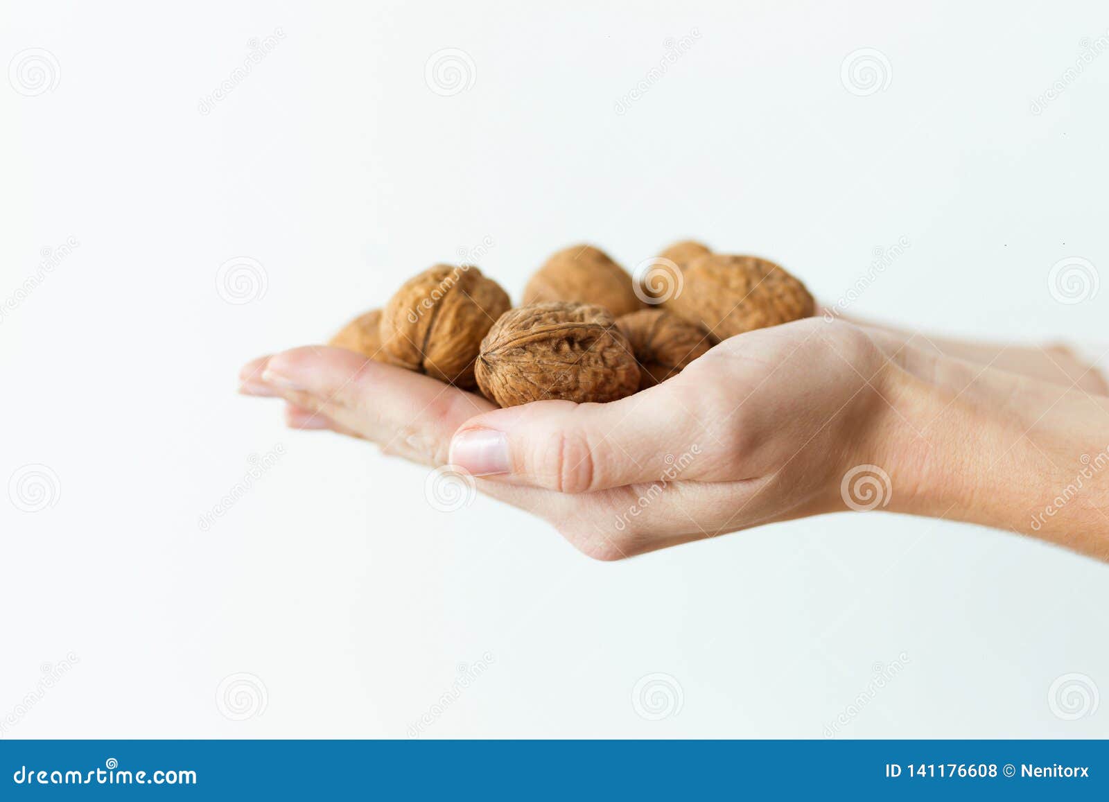 Young Woman Hand Holding Walnuts on White Background Stock Photo ...