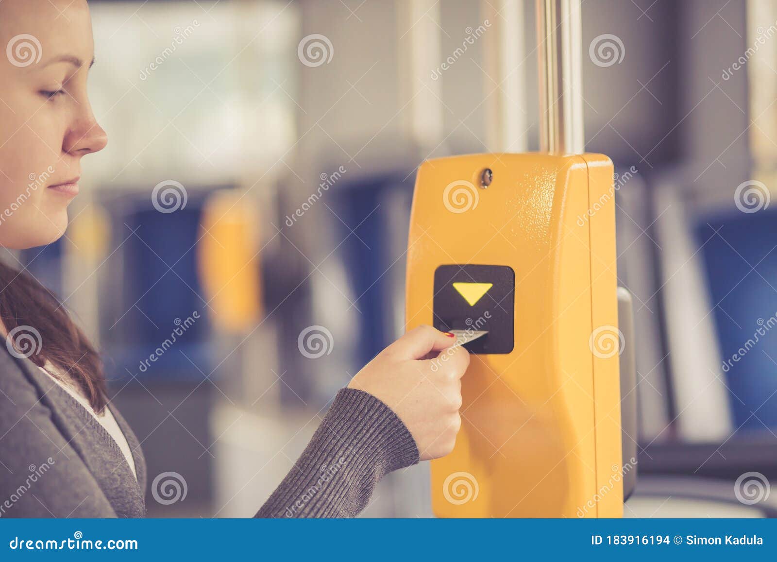 Young Woman Hand Inserts the Bus Ticket into the Validator, Validating ...