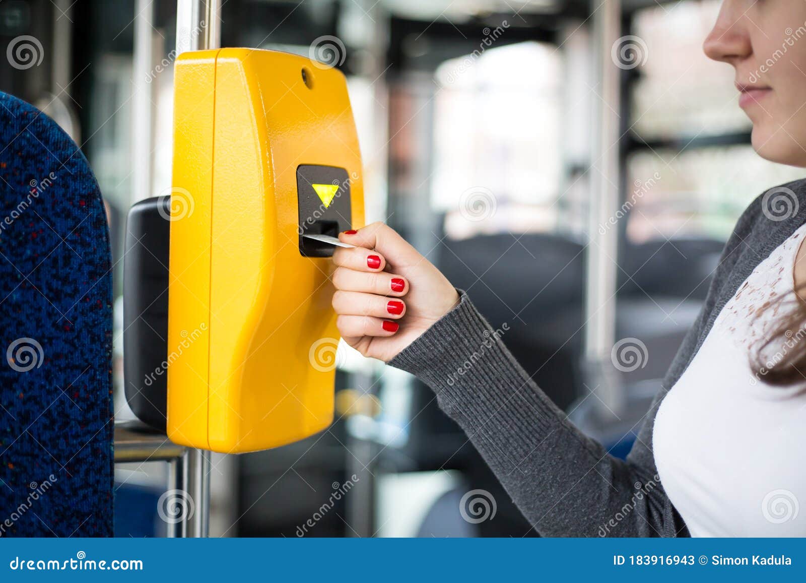 Young Woman Hand Inserts the Bus Ticket into the Validator, Validating ...
