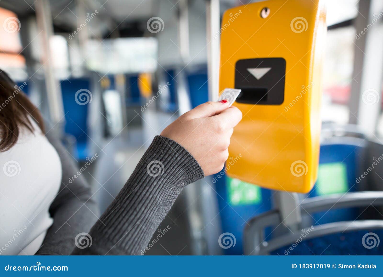 Young Woman Hand Inserts the Bus Ticket into the Validator, Validating ...
