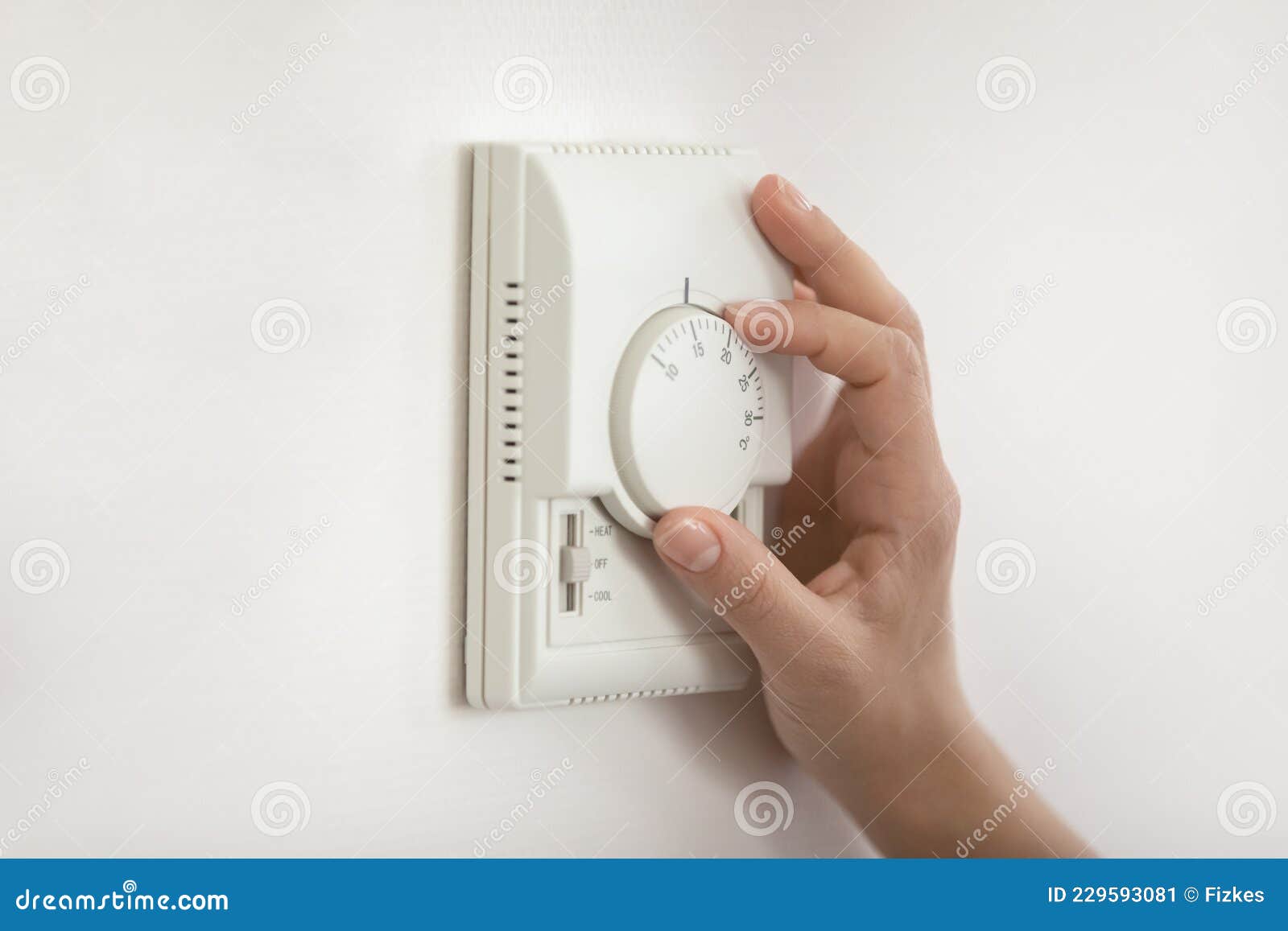 Young Woman Hand Switch on Temperature Regulator on Wall Panel Stock ...