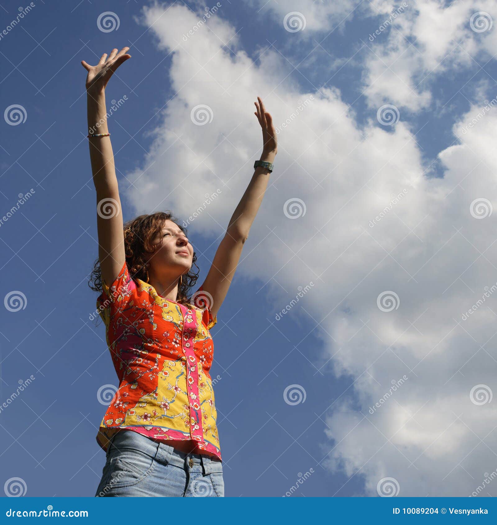 Young woman with hands up stock photo. Image of cloud - 10089204