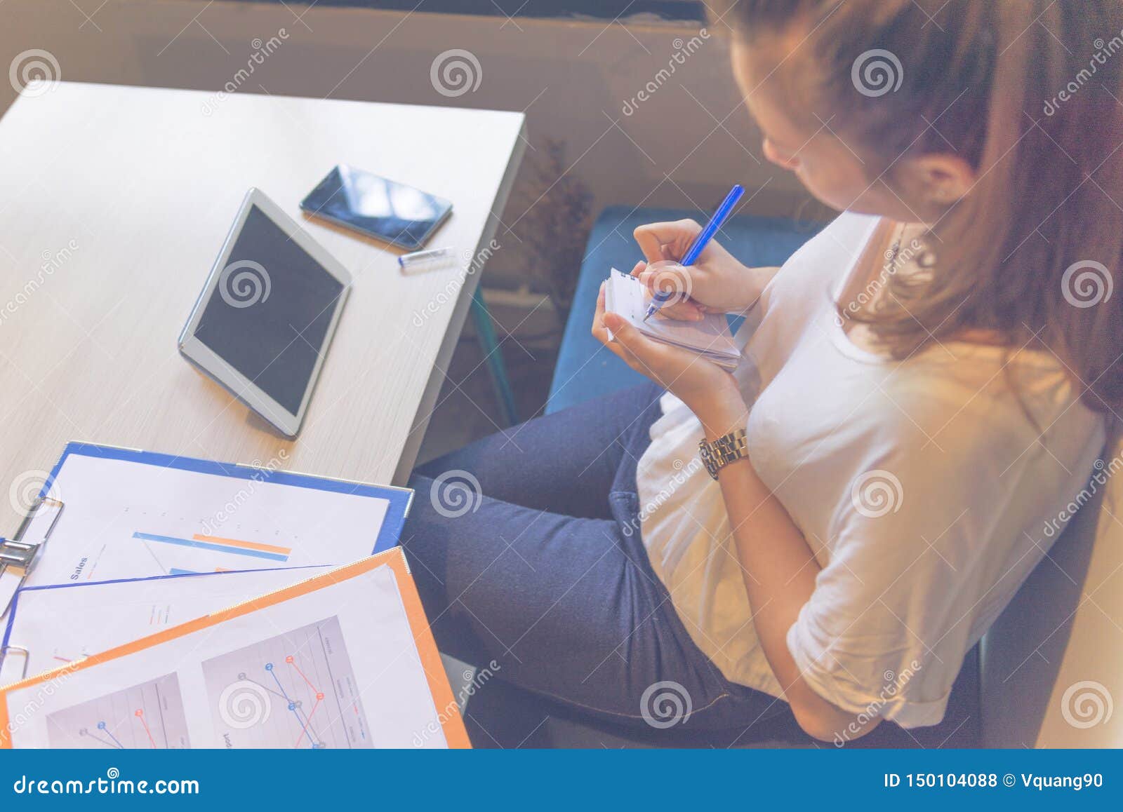 Young Woman Handwriting into Notes in Office Stock Photo - Image of ...