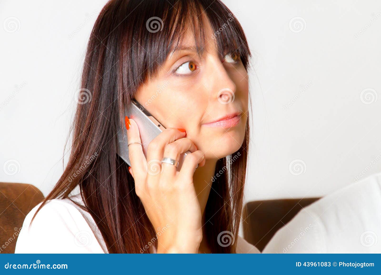 Young woman on handy stock image. Image of brunette, away - 43961083