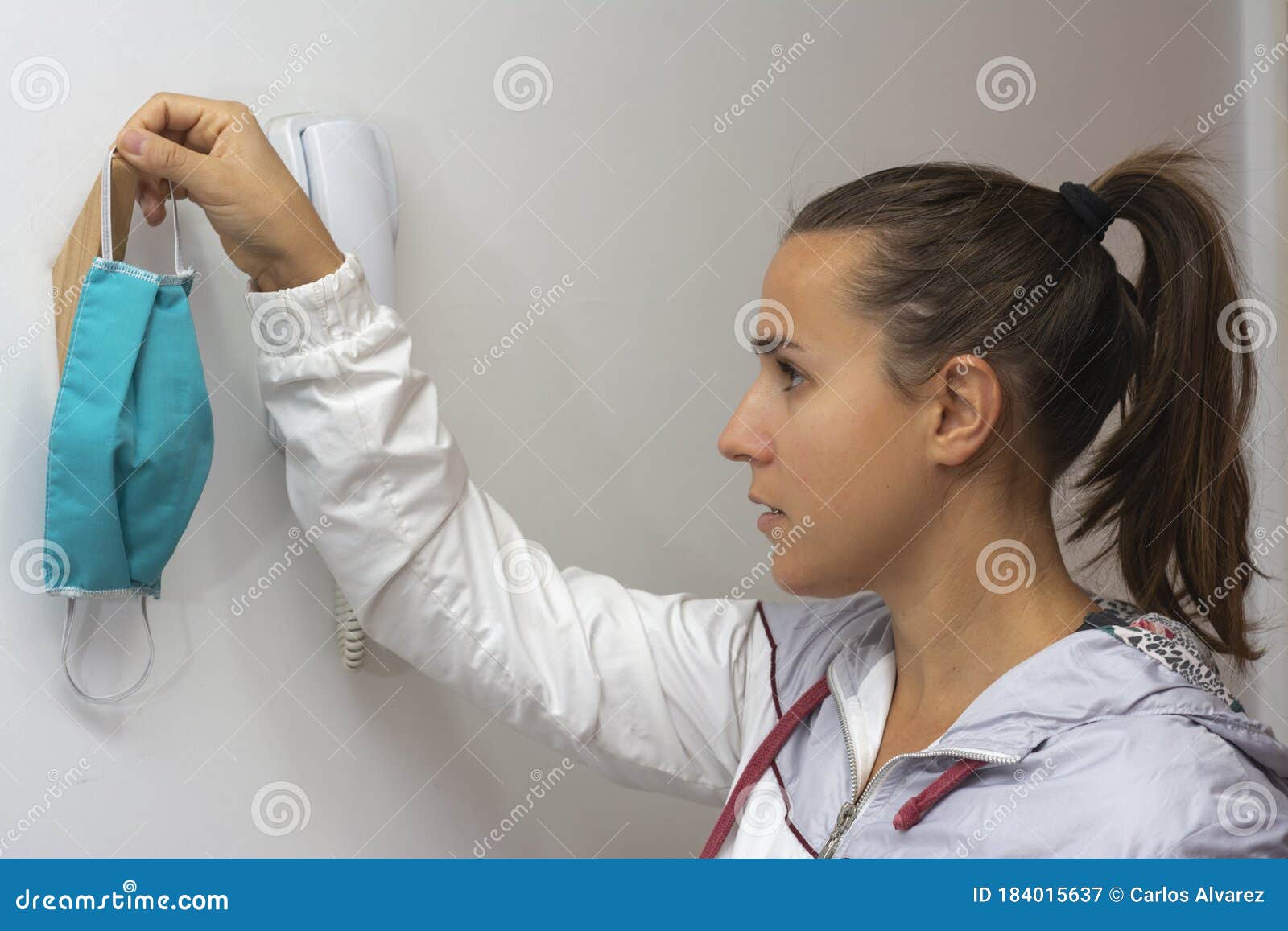 Young Woman Hanging Her Mask on the Rack Stock Image - Image of hung ...