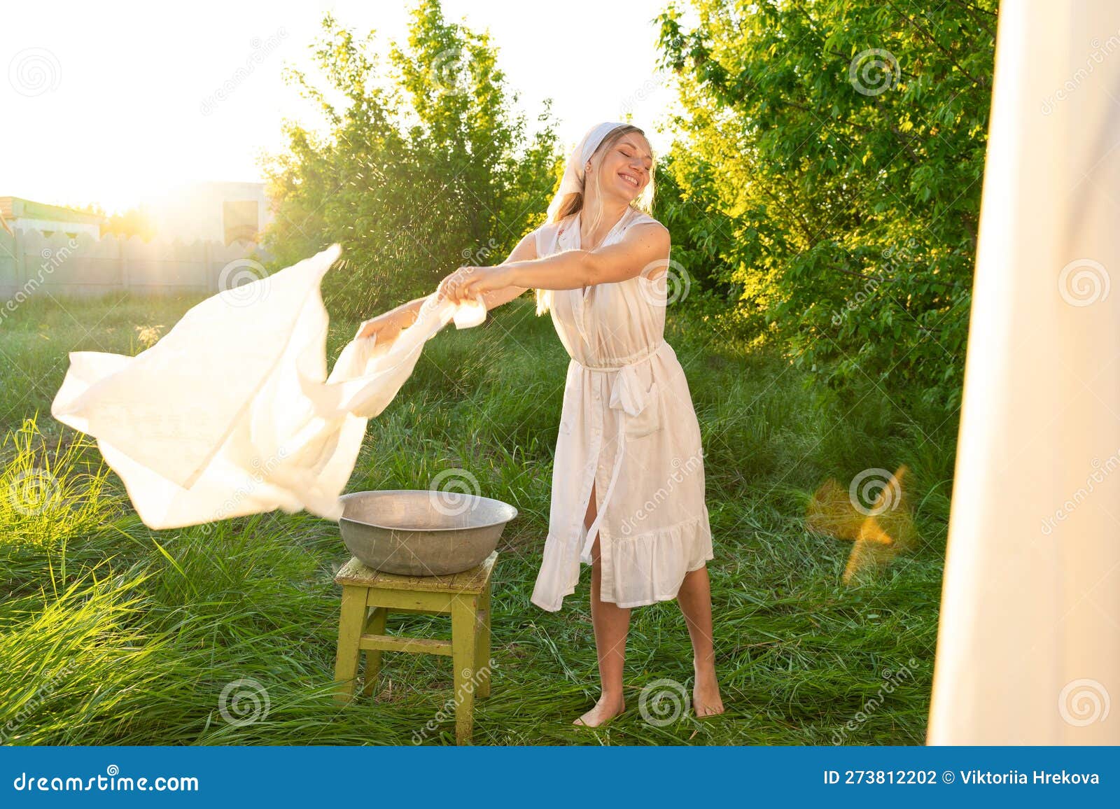 Young Woman Hanging Laundry Outdoors Beautiful Girl Working In