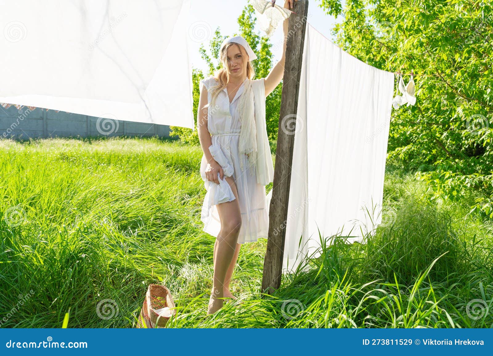 Young Woman Hanging Laundry Outdoors Beautiful Girl Working In