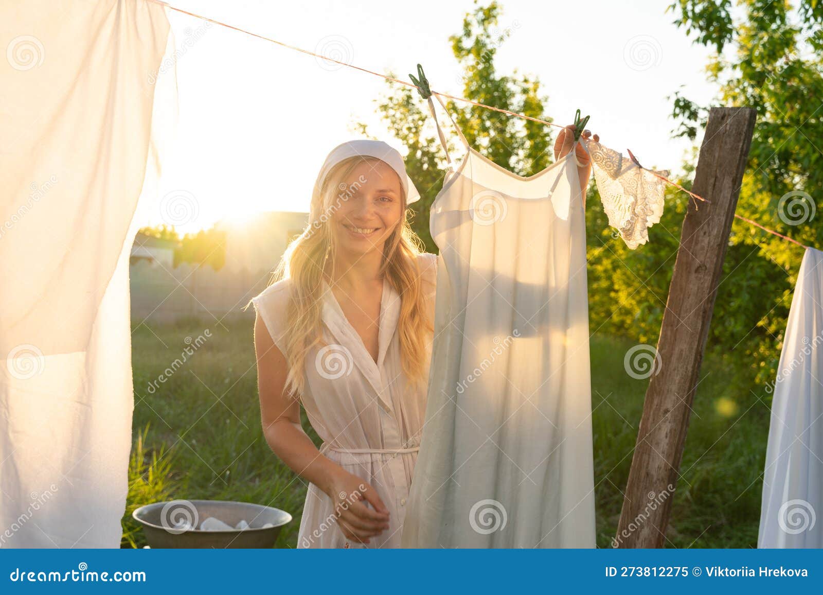 Young Woman Hanging Laundry Outdoors Beautiful Girl Working In
