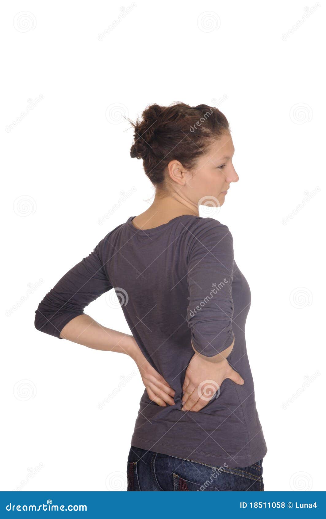 Young woman has back pain stock photo. Image of hand - 18511058