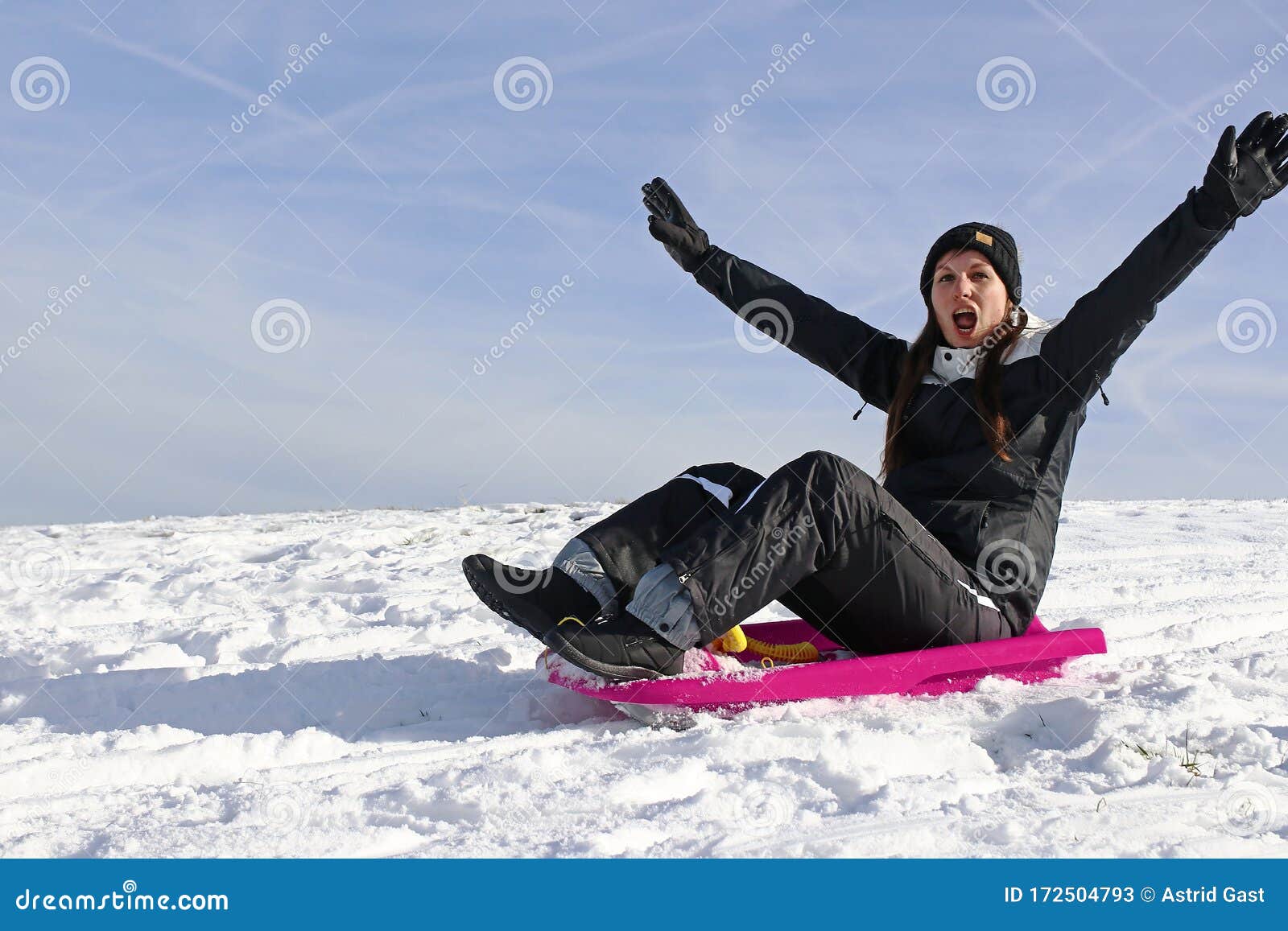 A Young Woman Has Fun Sledging in Winter Stock Image - Image of motion ...