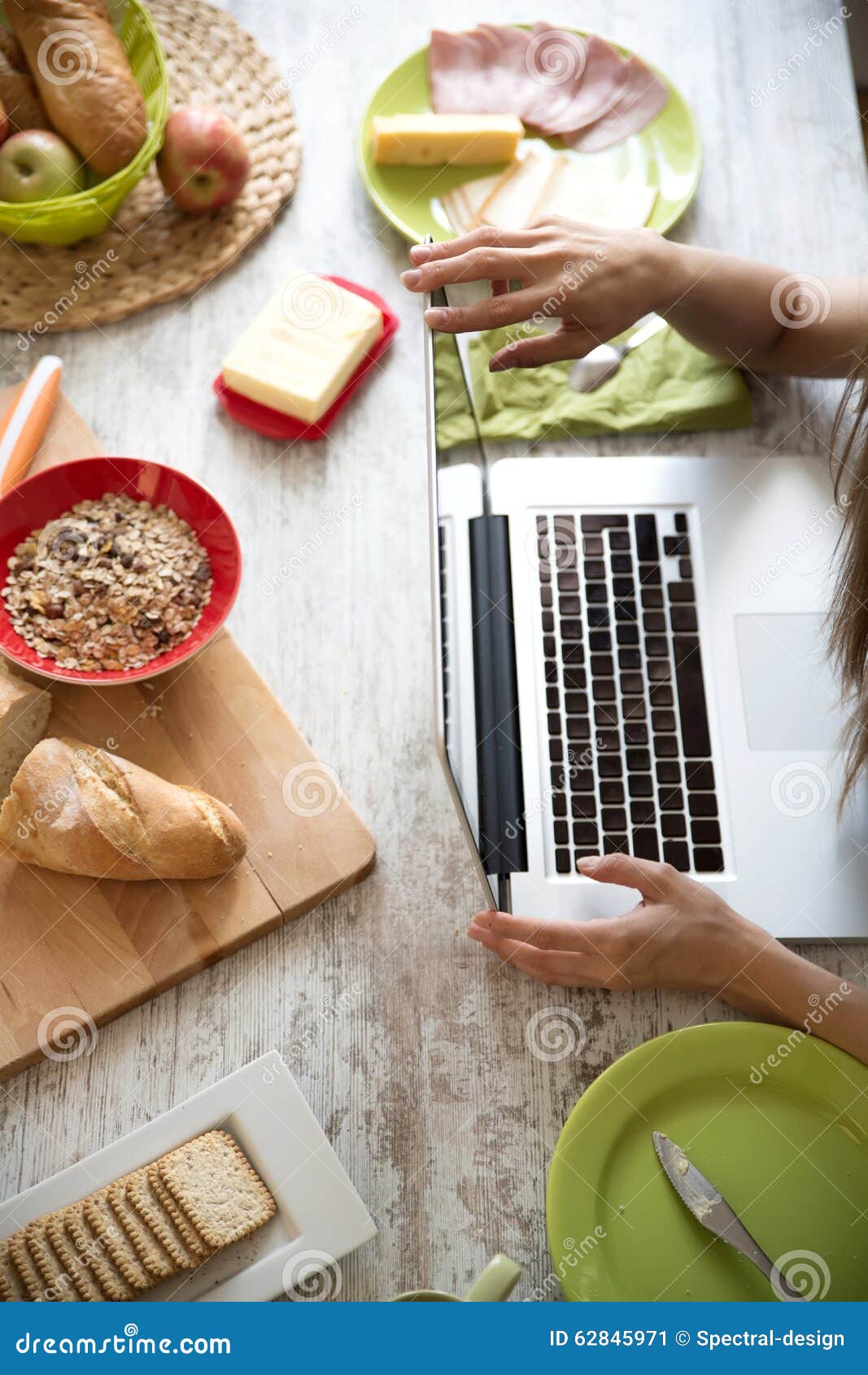 Young Woman Having Breakfast while Using a Laptop Computer Stock Image ...
