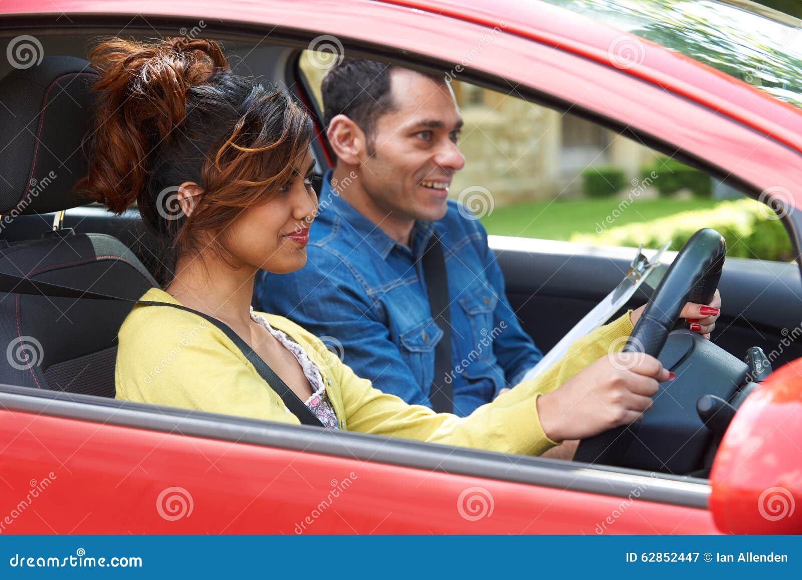 Young Woman Having Driving Lesson with Instructor Stock Image - Image ...