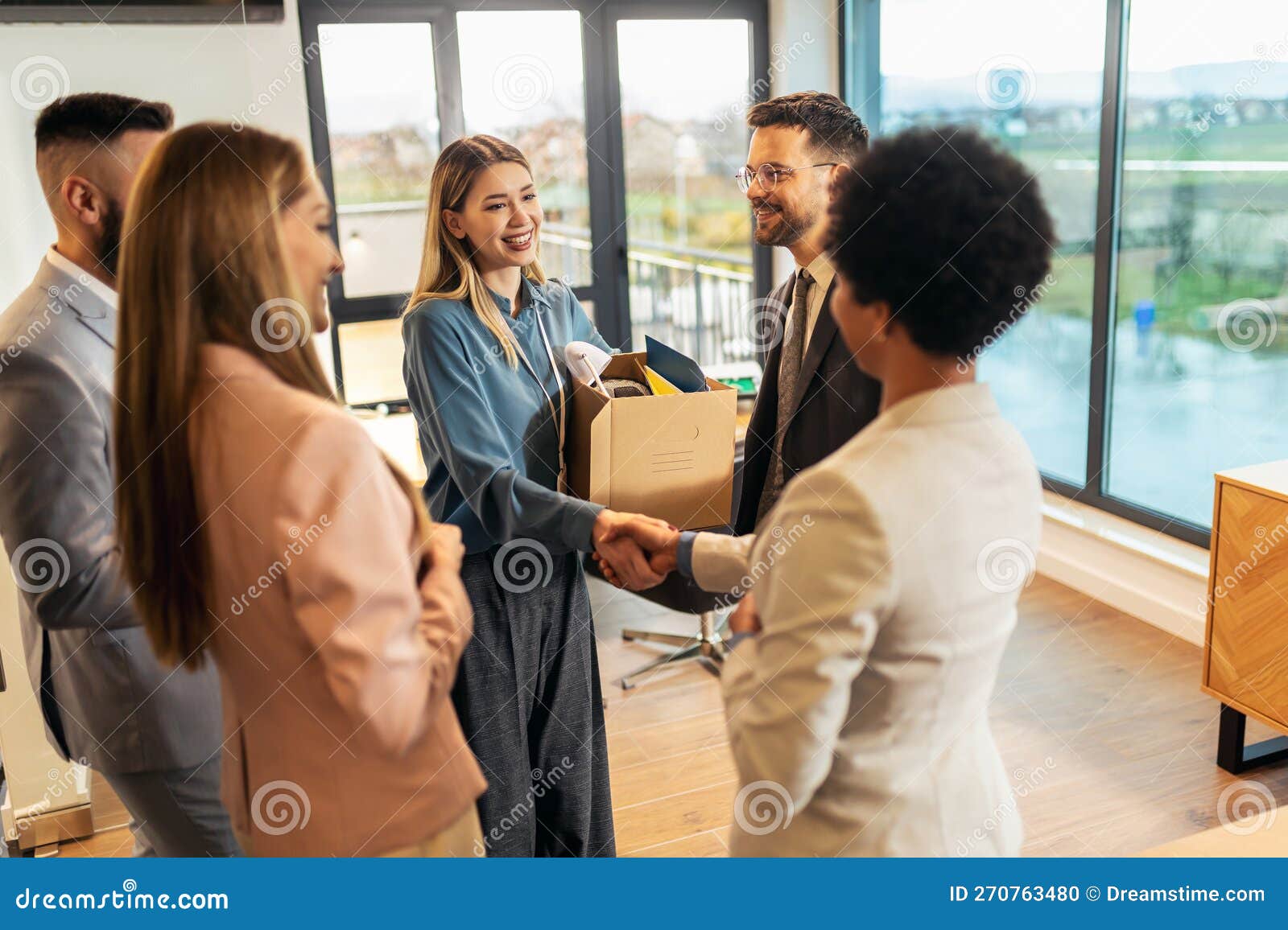 Woman Having First Working Day Getting Acquainted with Colleagues Stock ...