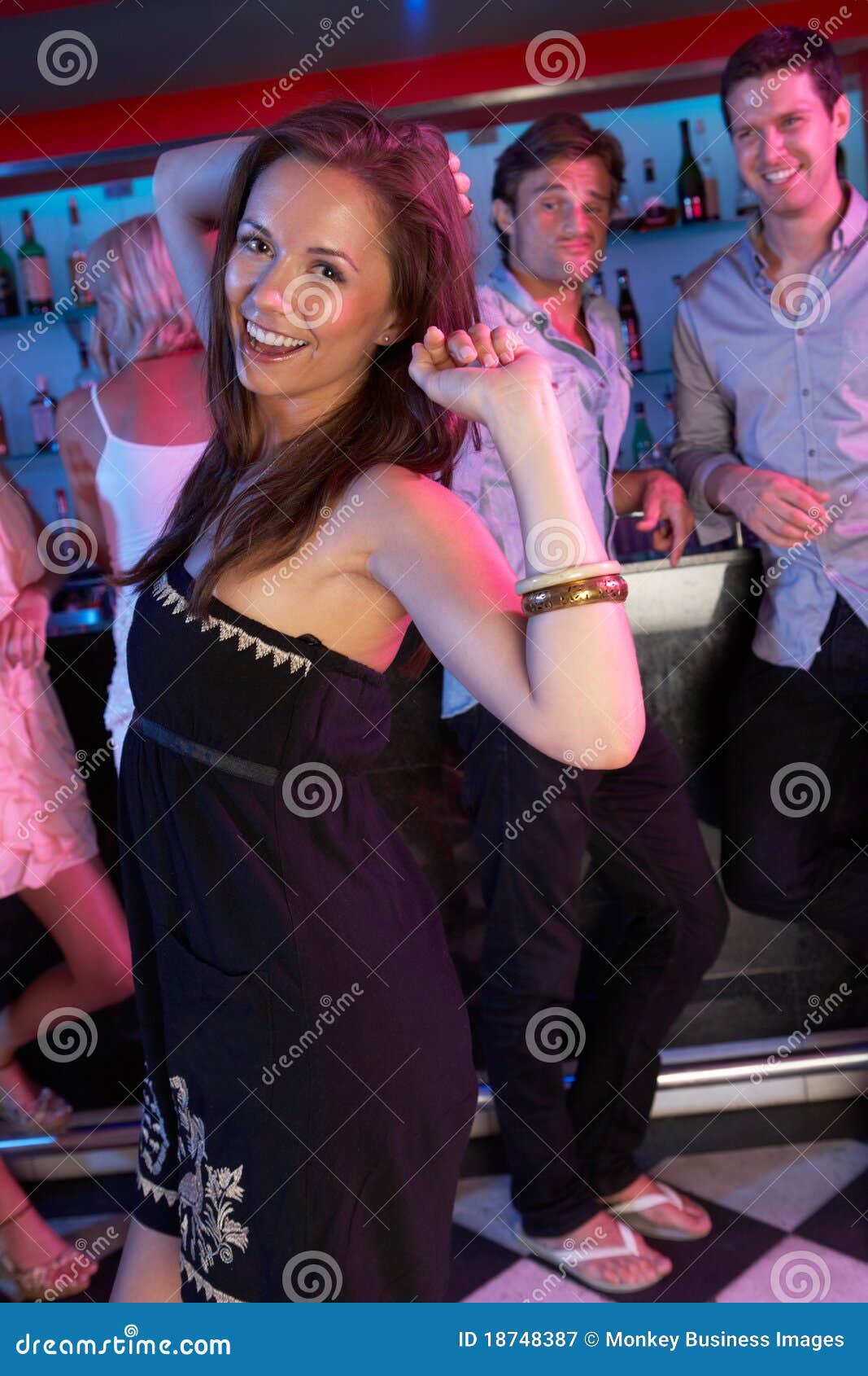 Young Woman Having Fun in Busy Bar Stock Image - Image of smiling ...