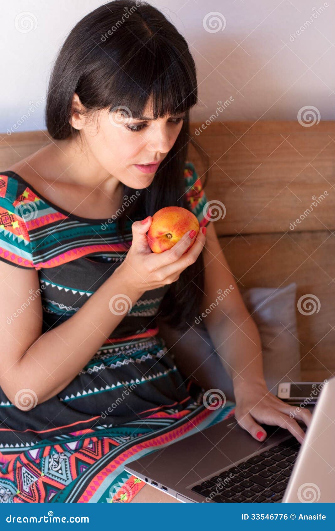 Young Woman Having a Healthy Snack while Working Stock Photo - Image of ...
