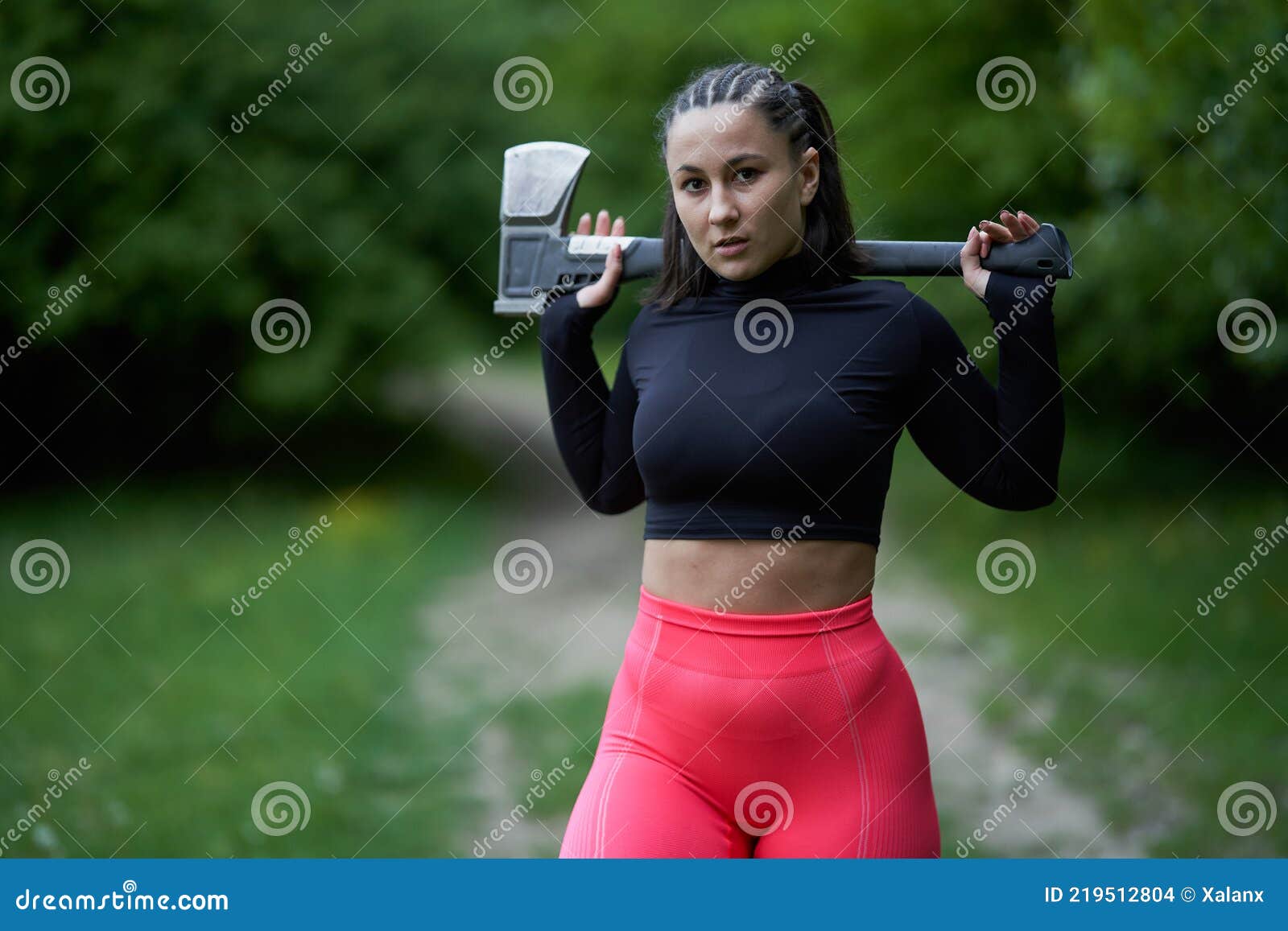 Young woman with heavy axe stock photo. Image of green - 219512804