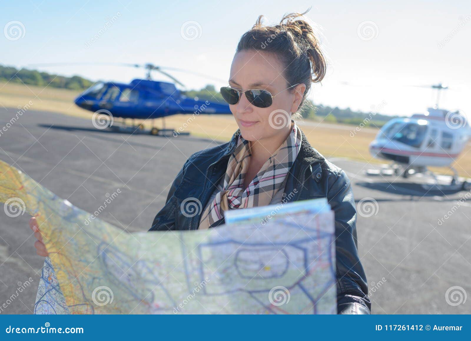 Young Woman Helicopter Pilot Reading Map Stock Photo - Image of journey ...
