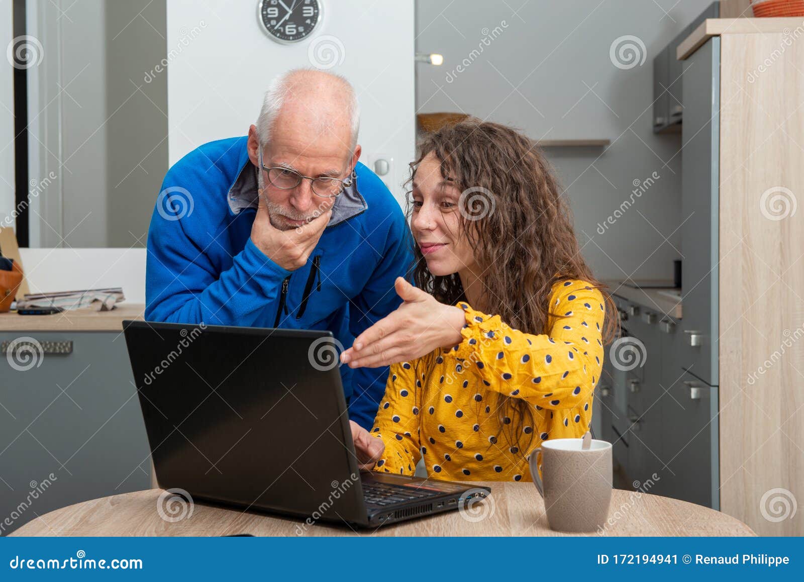 Young Woman Helps Senior on Laptop Computer Stock Image - Image of ...