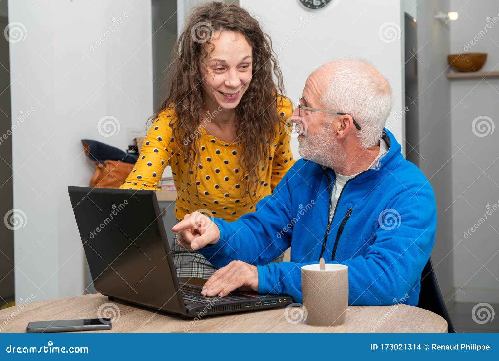 Young Woman Helps Senior on Laptop Computer Stock Photo - Image of ...