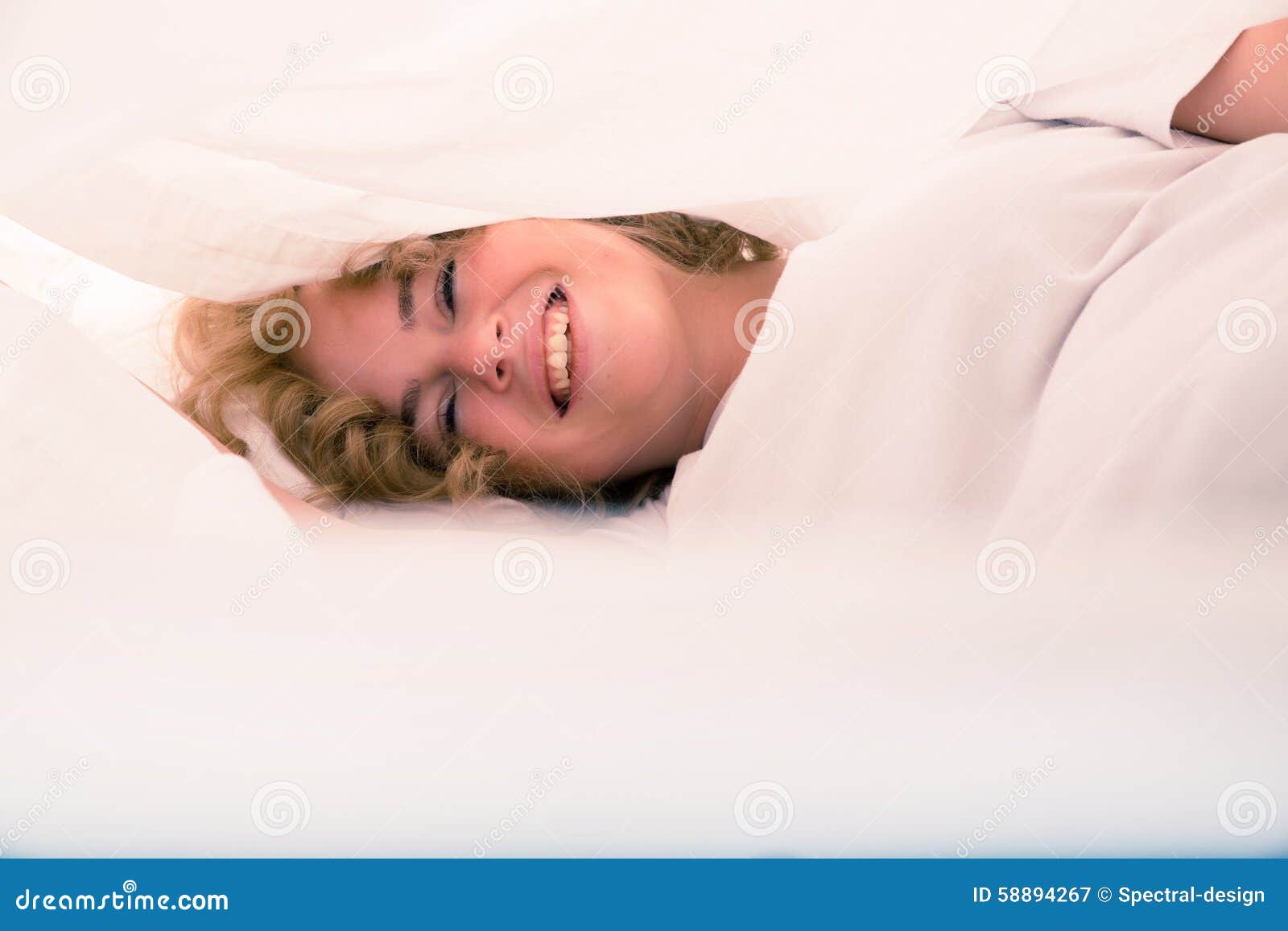 Young Woman Hiding in Bed Under the Sheets Stock Image - Image of ...