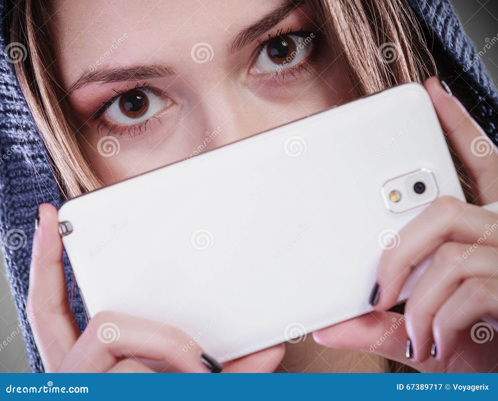 Young Woman Hiding Behind Phone. Stock Image - Image of teenage, cell ...