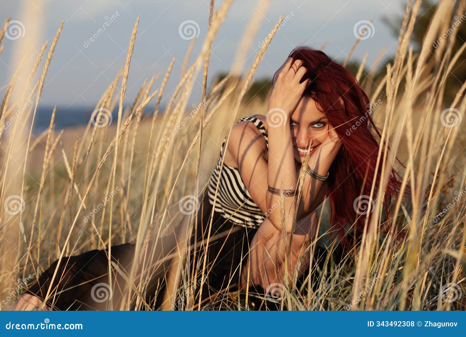 Young Woman Hiding in the Grass Stock Photo - Image of hair, lifestyles ...