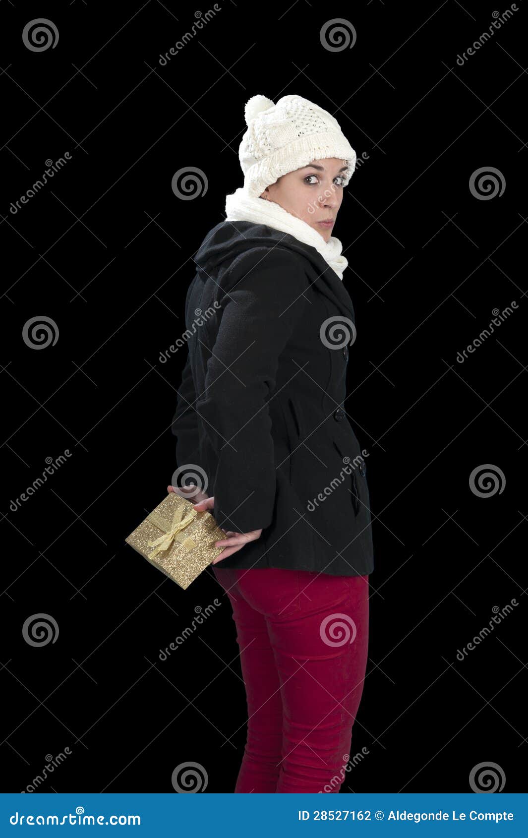 Young Woman Hiding a Present Behind Her Back Stock Photo - Image of ...