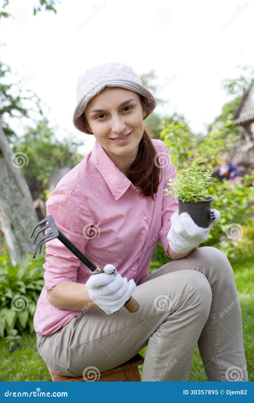 Young Woman with Hoe Working Stock Image - Image of outdoors, hand ...