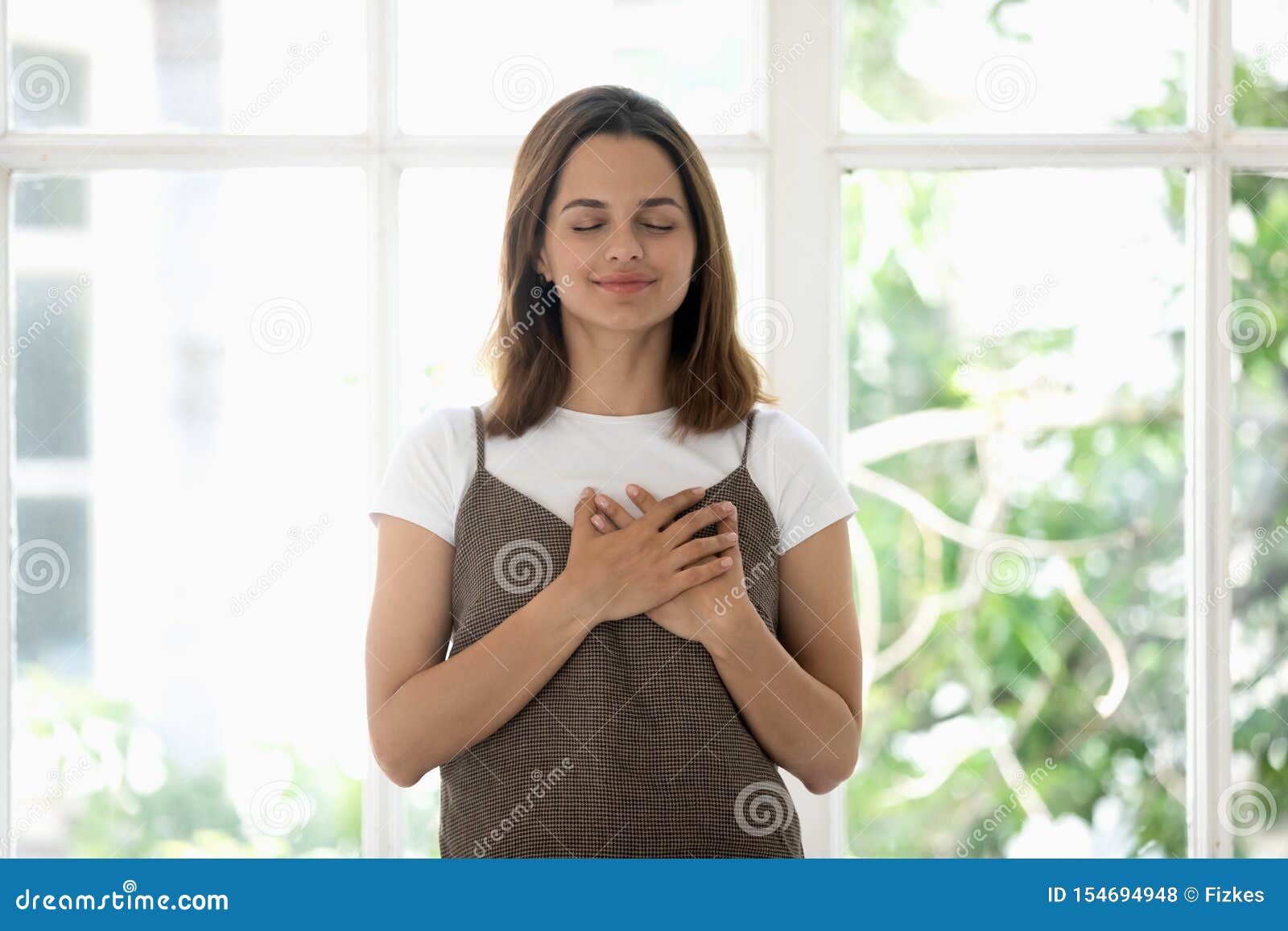 Young Woman Holding Both Hands on Heart Symbol of Gratitude Stock Photo ... Young Woman Holding Both Hands on Heart Symbol of Gratitude Stock Photo ...