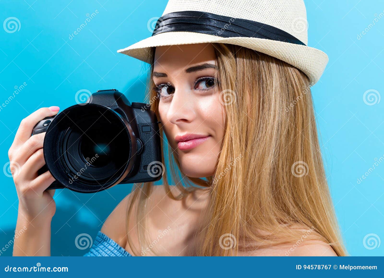 Young Woman Holding a Camera Stock Image - Image of camera, girl: 94578767