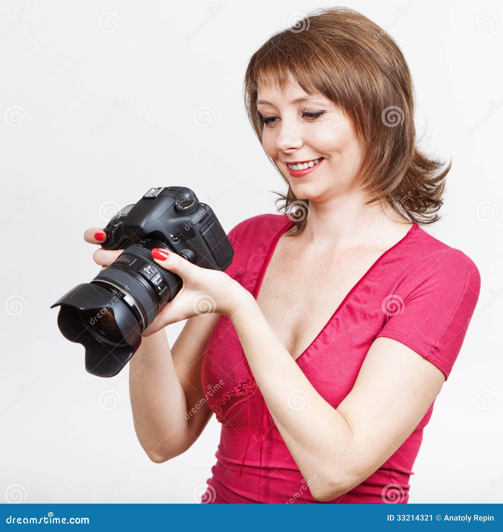 Young Woman Holding Camera and Looking Photos Stock Image - Image of ...