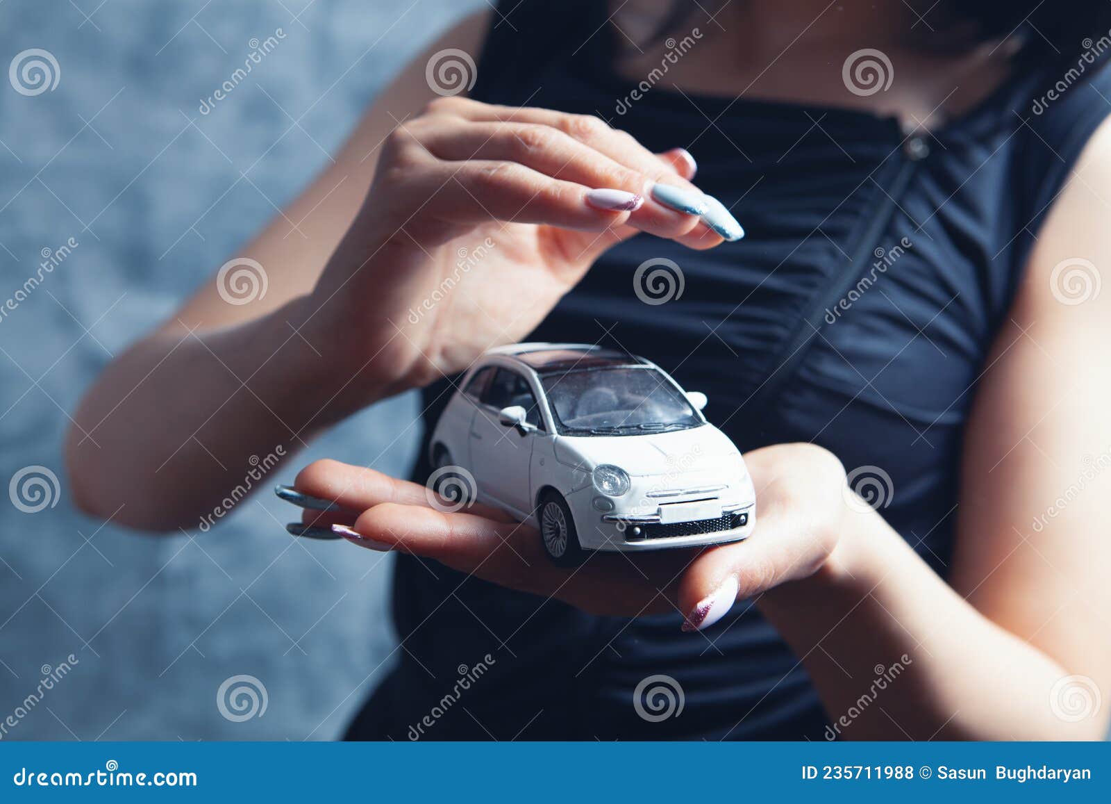 Young woman holding a car stock photo. Image of travel - 235711988