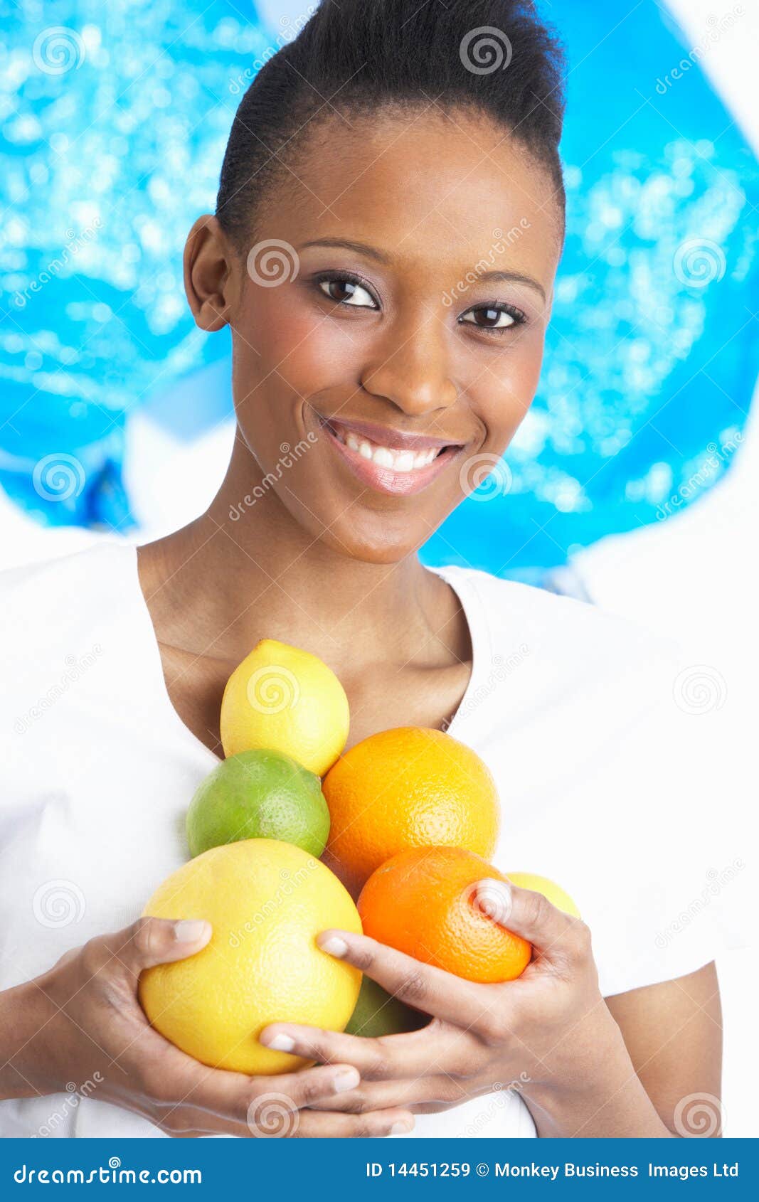 Young Woman Holding Citrus Fruit in Studio Stock Image - Image of ...