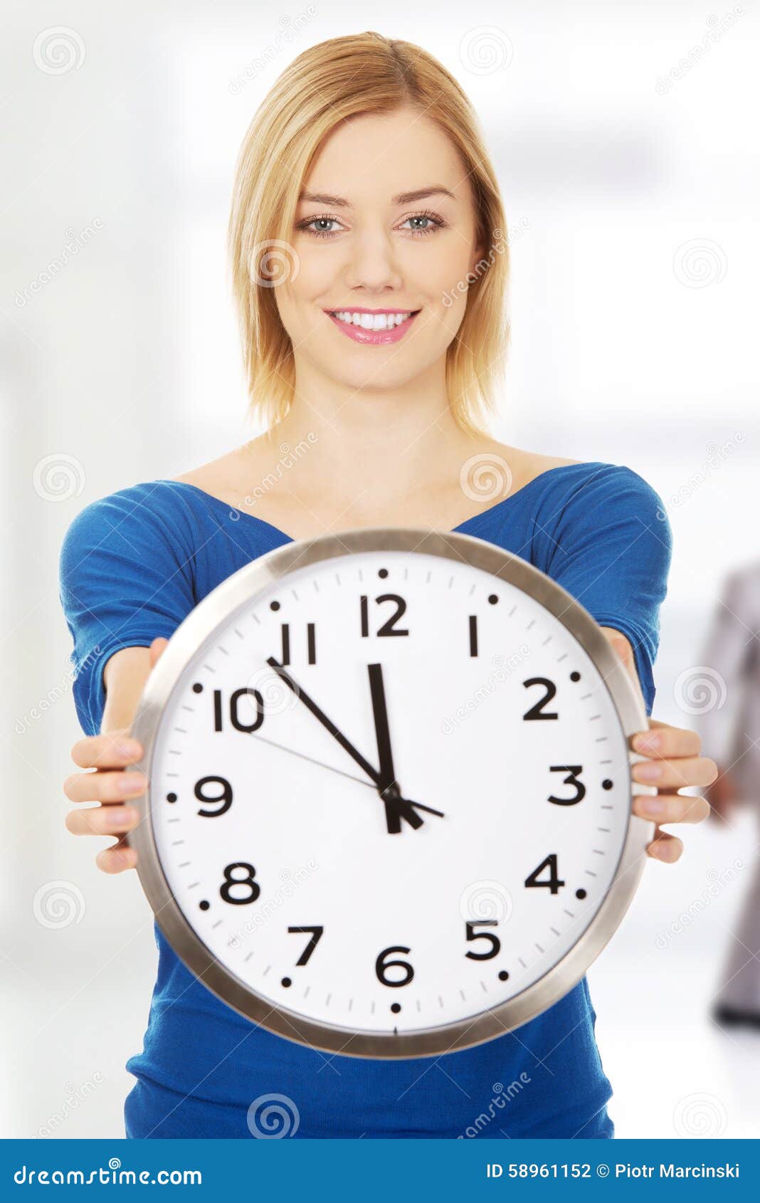 Young Woman Holding a Clock. Stock Photo - Image of blonde, smiling ...