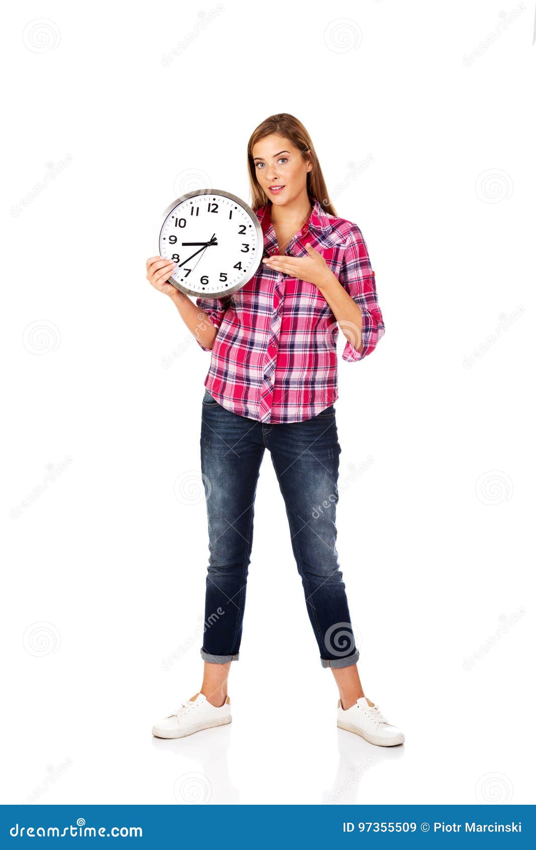 Young Woman Holding Clock and Pointing for it Stock Image - Image of ...