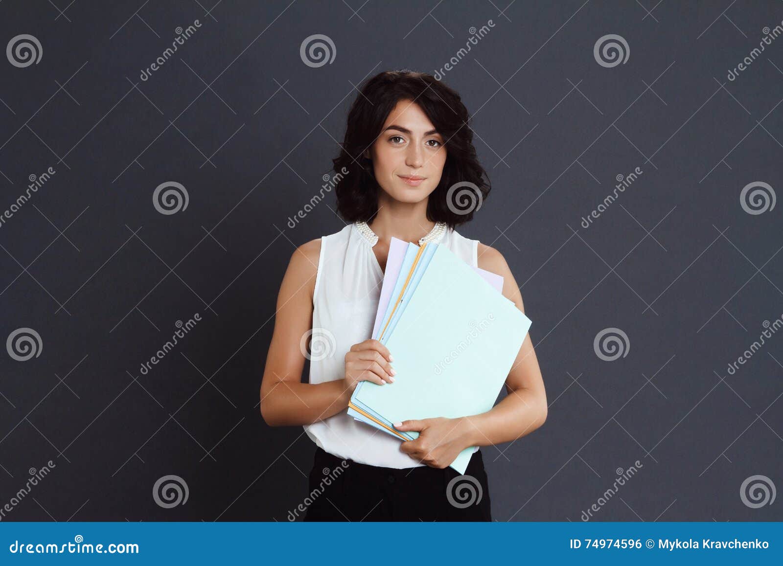 Young Woman Holding Documents in Hands Over Grey Background Stock Photo ...