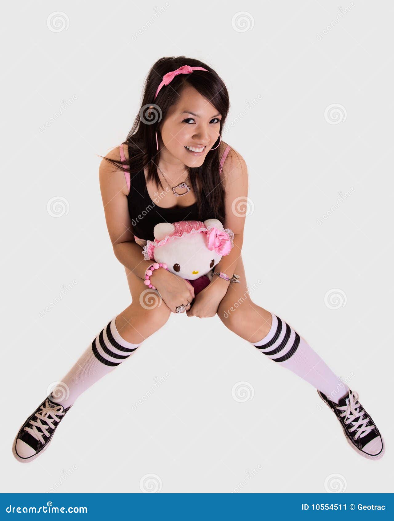Young woman holding doll stock image. Image of headband - 10554511 Young woman holding doll stock image. Image of headband - 10554511