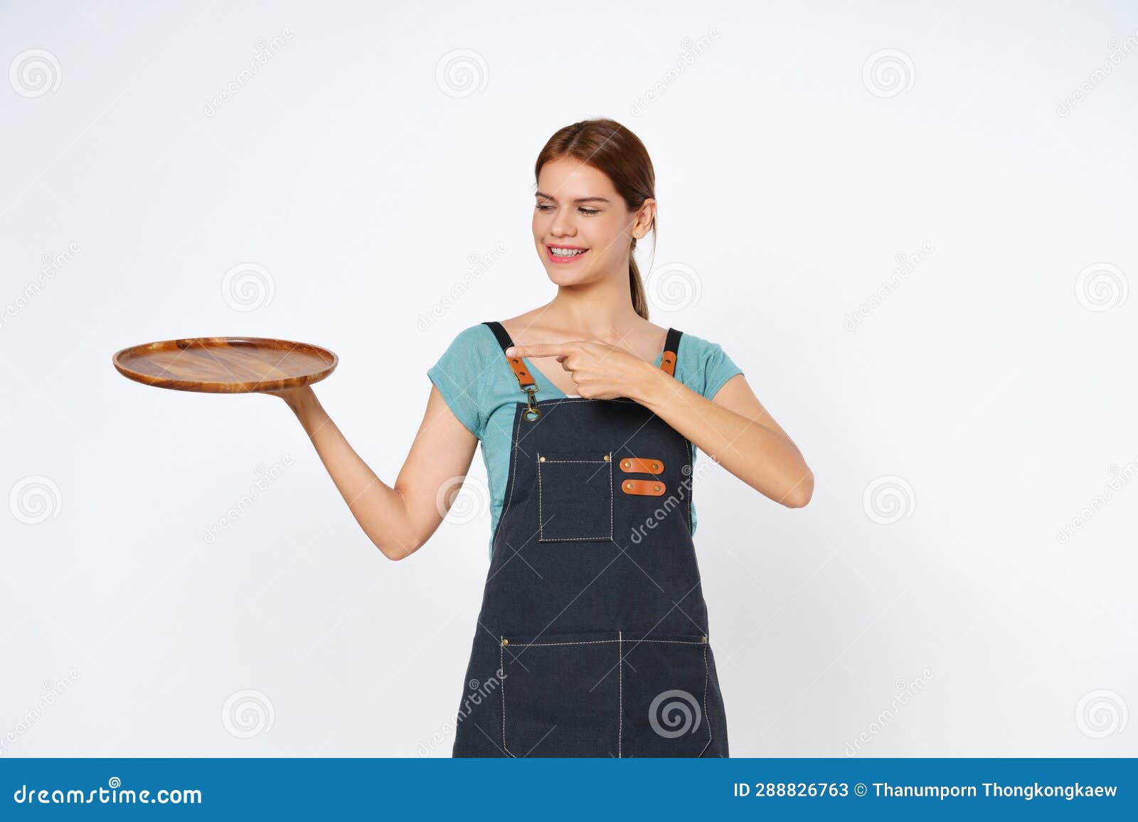 Young Woman Holding Empty Plate or Dish and Pointing Isolated on White ...