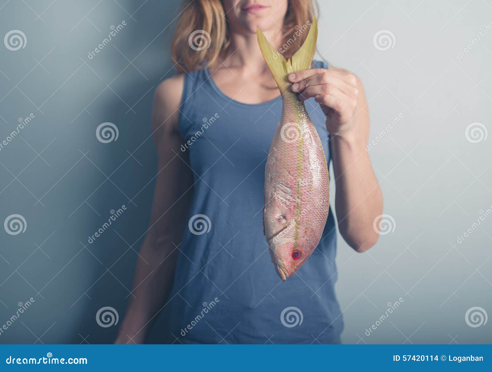Young Woman Holding Exotic Fish Stock Photo - Image of chef, person ...